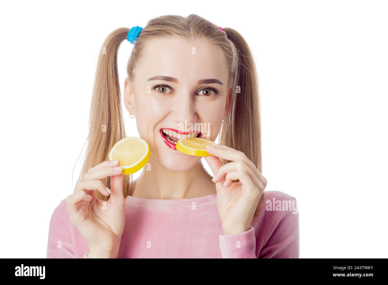 beautiful fun girl with pieces of lemon posing on white background ...