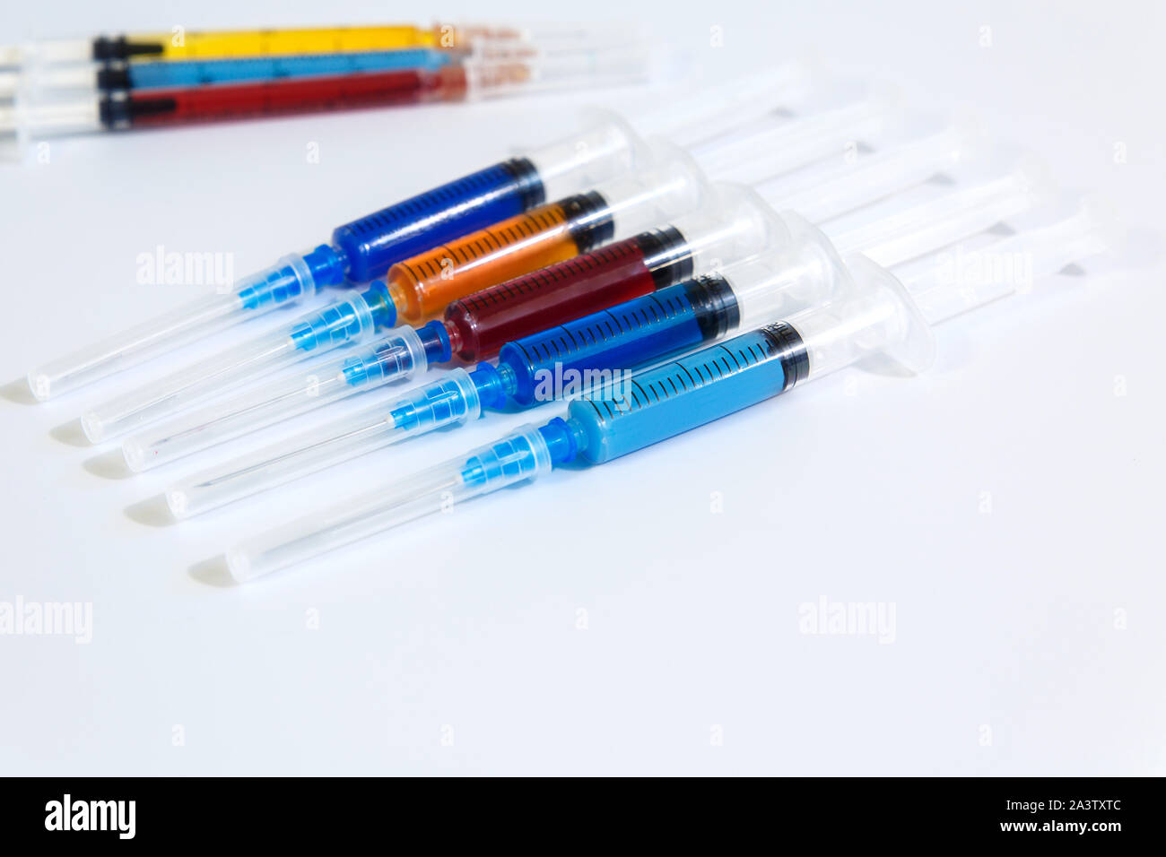 Medical syringes with colorful injections for cosmetology. Syringes ...