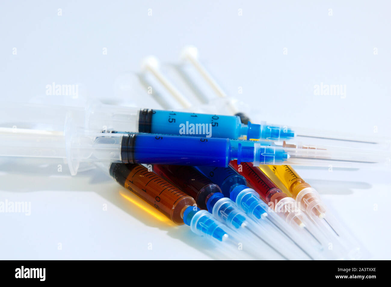 Medical syringes with colorful injections for cosmetology. Syringes ...