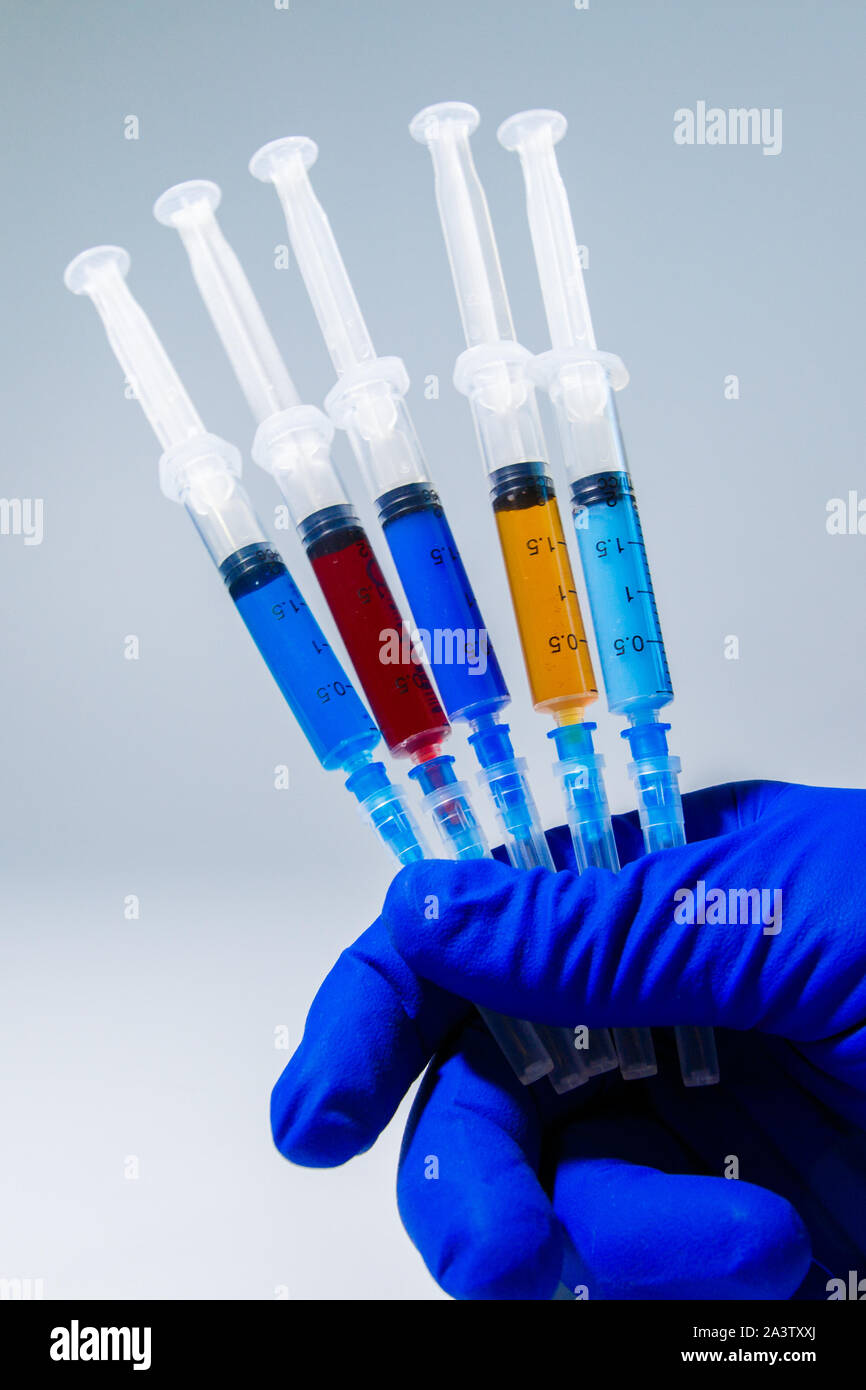 Medical syringes with colorful injections for cosmetology. Syringes ...
