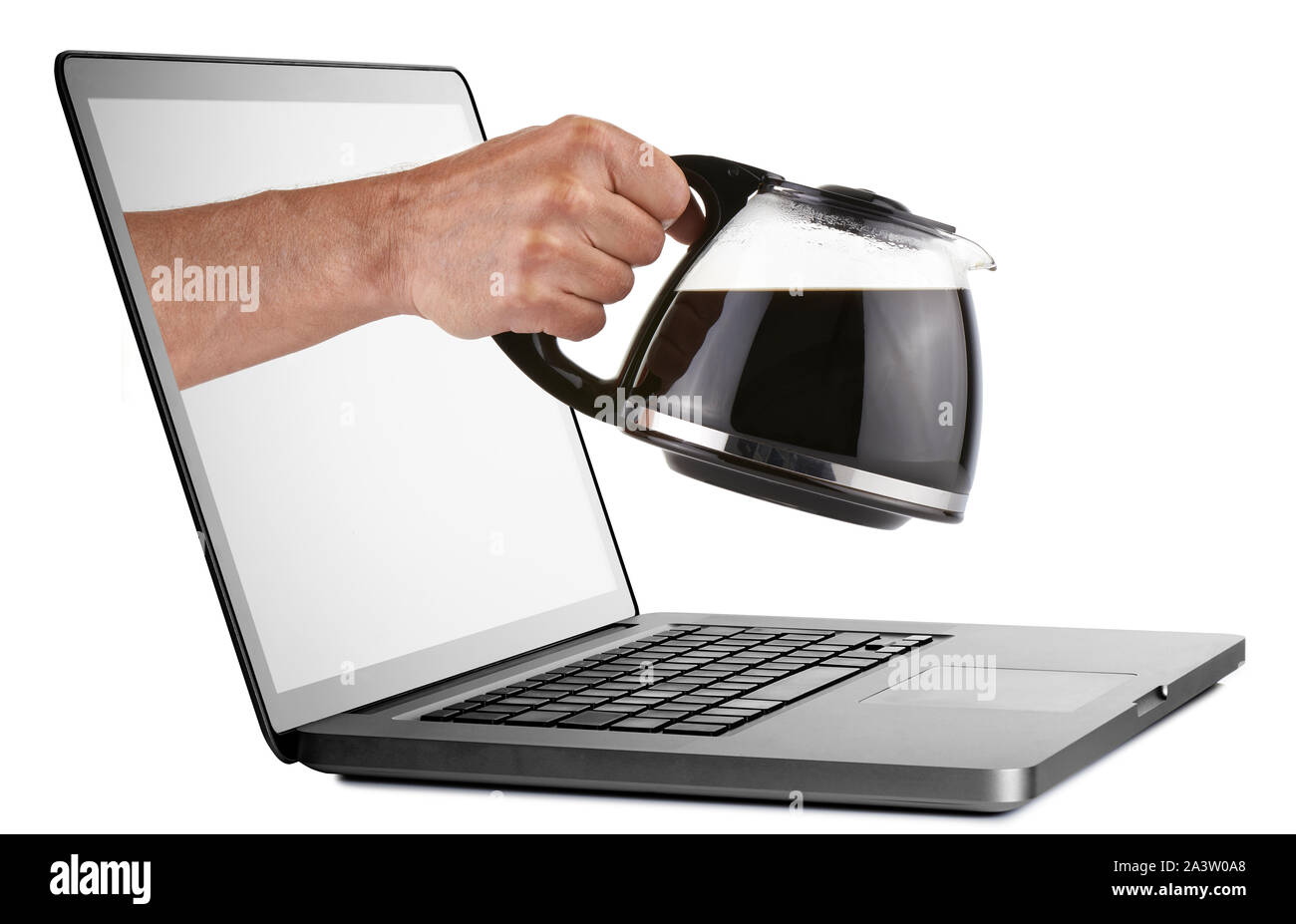 laptop with man's hand holding and pouring coffee Stock Photo - Alamy