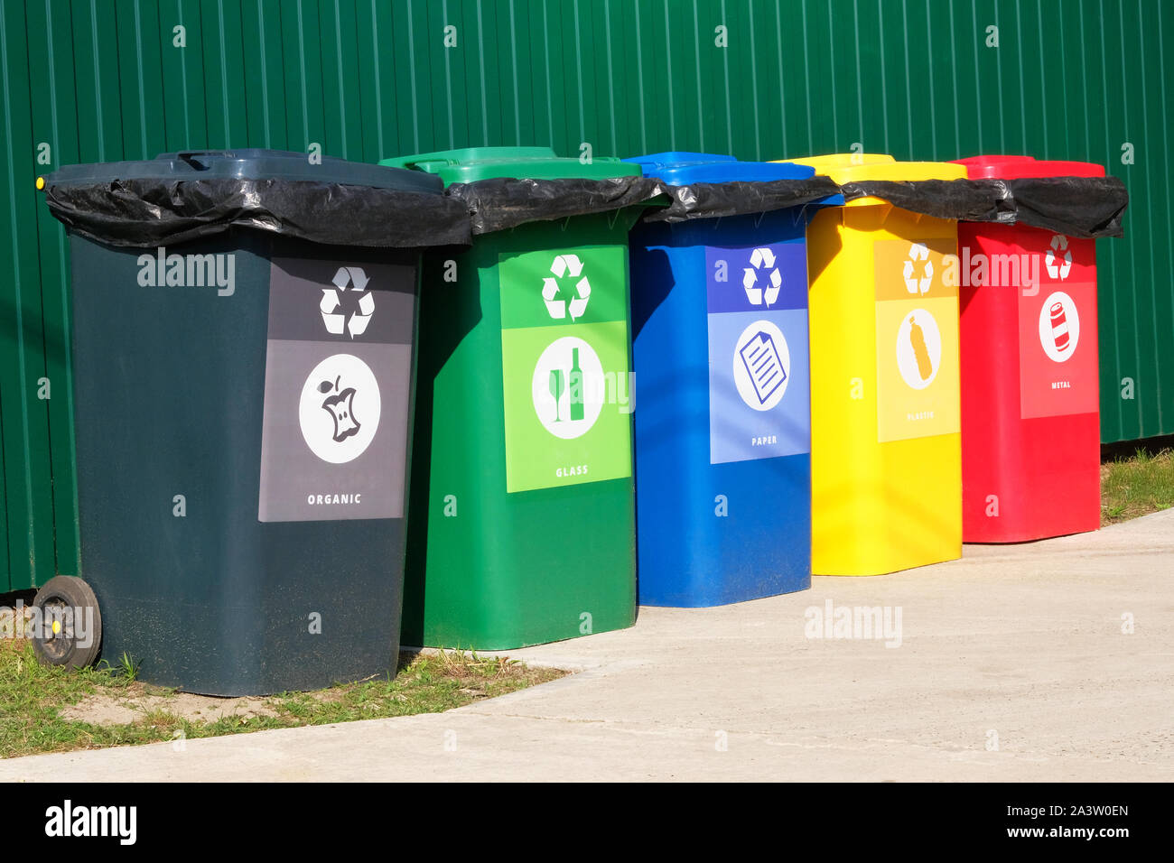 Separate garbage. Waste recycling concept. Containers for metal, glass ...