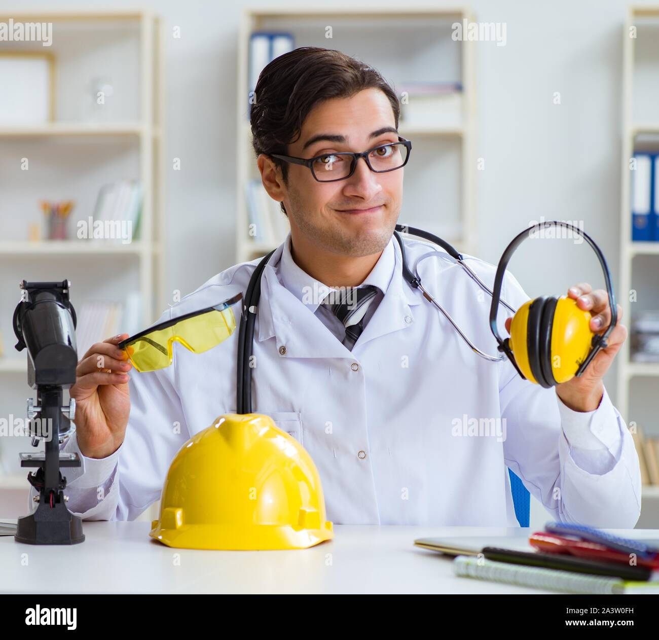 The safety doctor advising about noise cancelling headphones Stock ...