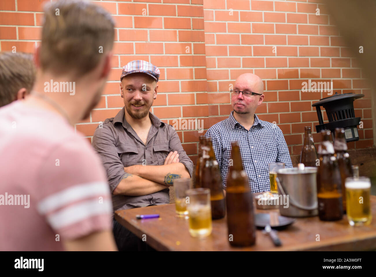 Beer drinking crossed arms hi-res stock photography and images - Alamy