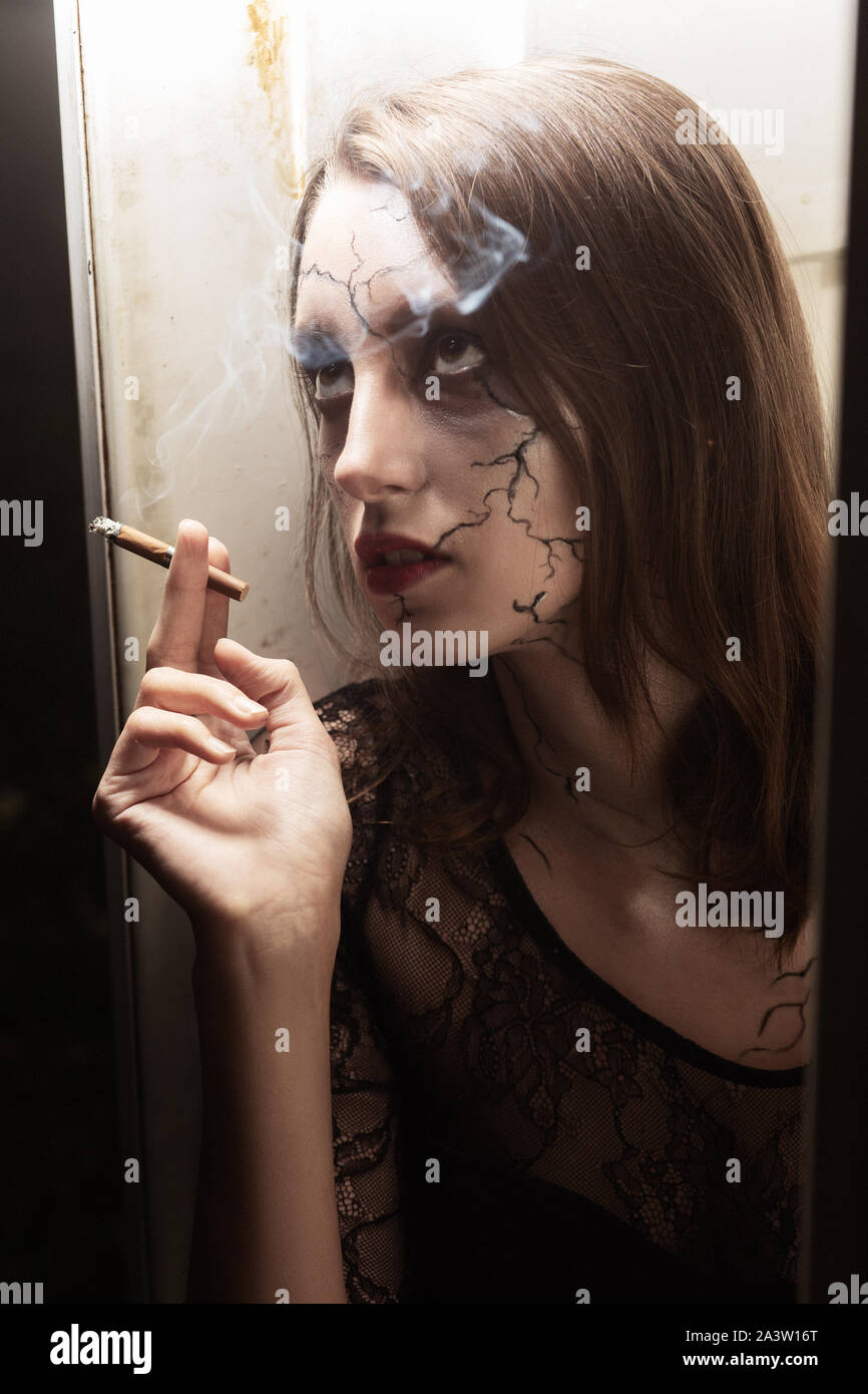 Angry woman smoking cigarette hi-res stock photography and images - Alamy