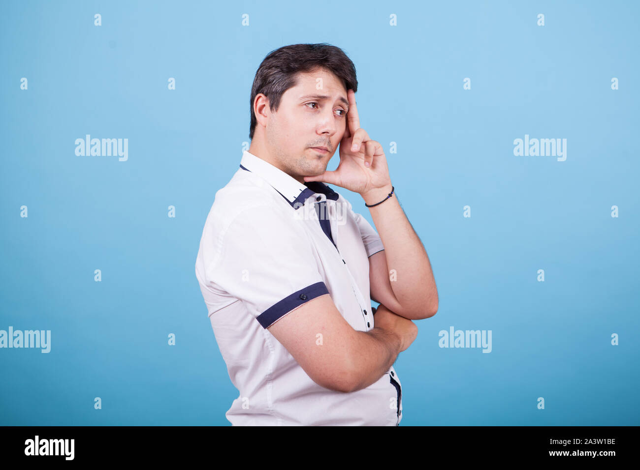 Side view portrait of young caucasian man looking concerned. Facial ...