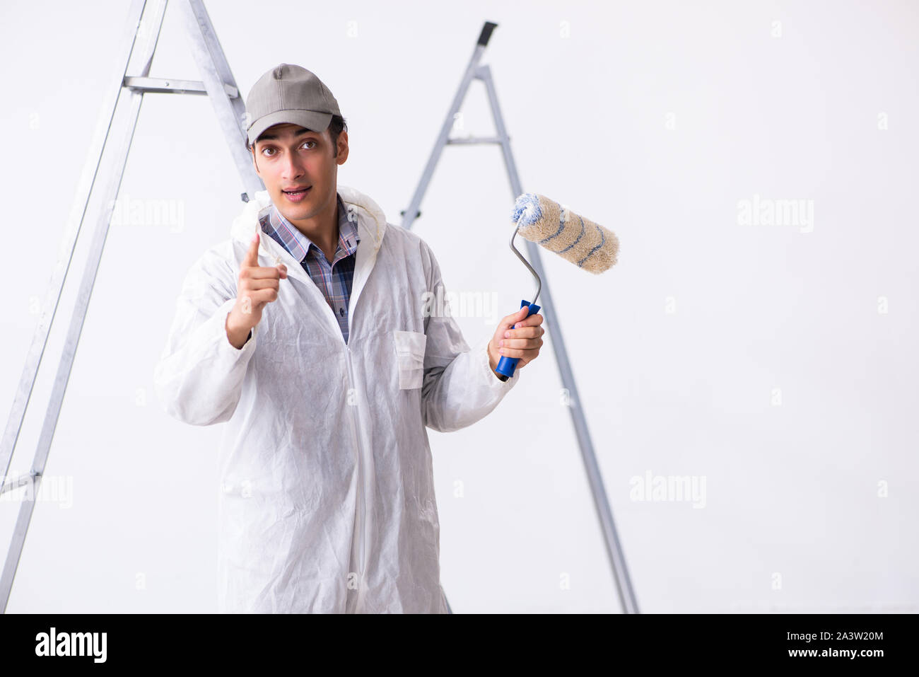 Painter working at the construction site Stock Photo - Alamy
