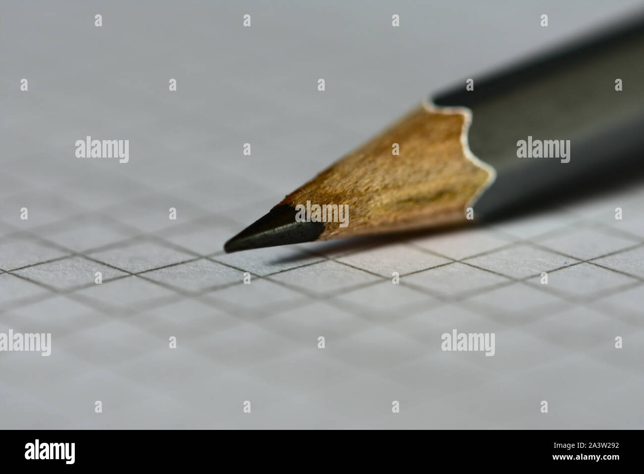 Sharp pencil on math paper Stock Photo - Alamy
