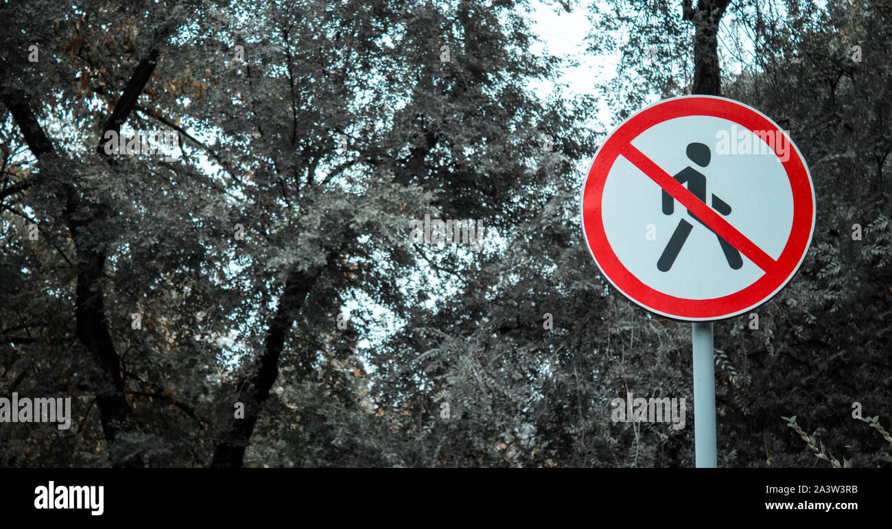prohibition sign white with red on a background of leaves. prohibiting ...