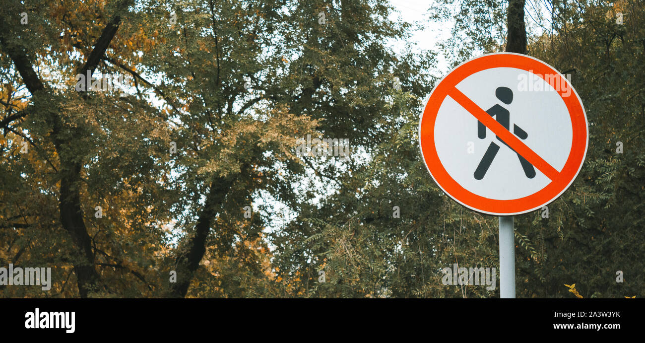 prohibition sign white with red on a background of leaves. prohibiting ...