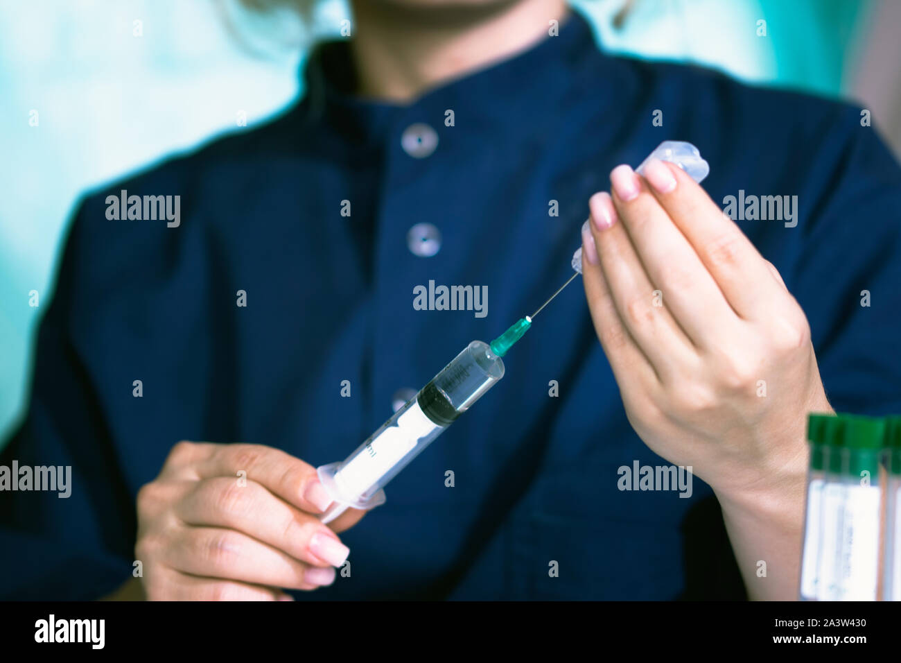Doctor, nurse preparing syringe for injection, doctor preparing ...