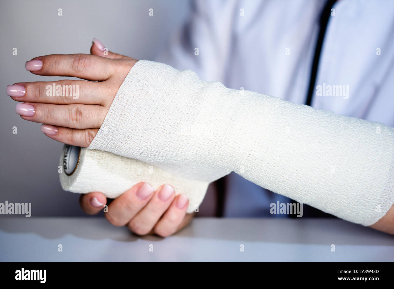 Doctor self bandaging, self care, bandage hand Stock Photo - Alamy