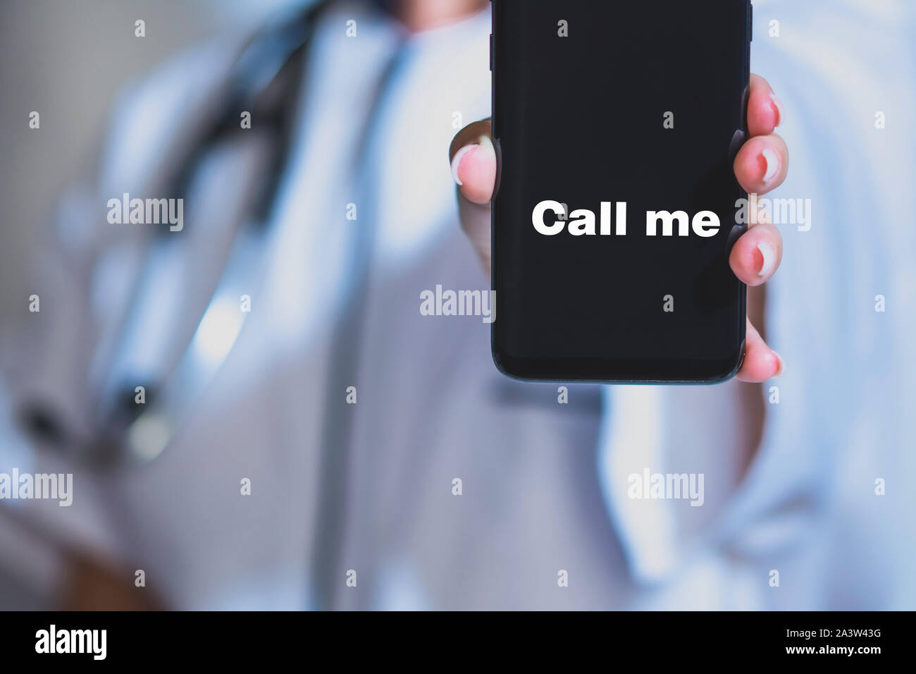 Doctor with telephone in hand, call doctor concept Stock Photo - Alamy