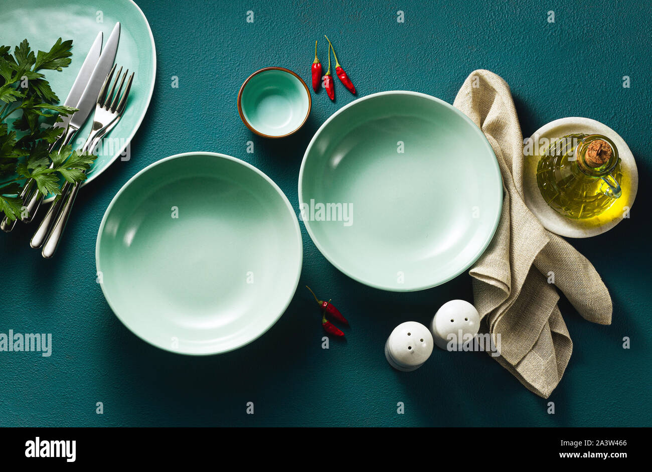set of empty plates on a blue table. empty serving design form Stock ...