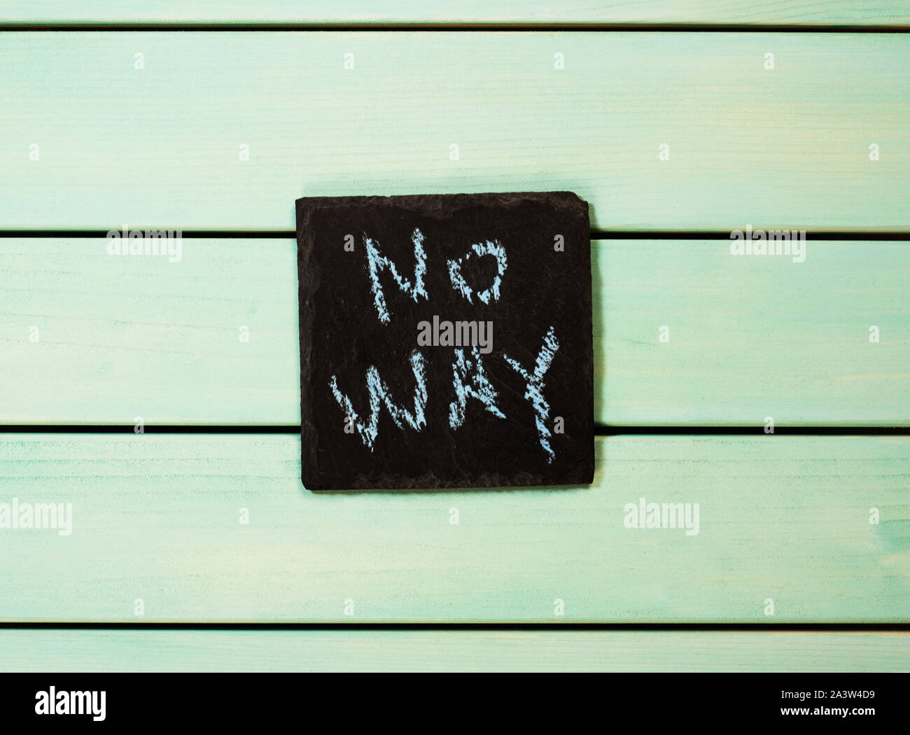 Handwitten no way words on blue wooden background, impossible concept ...