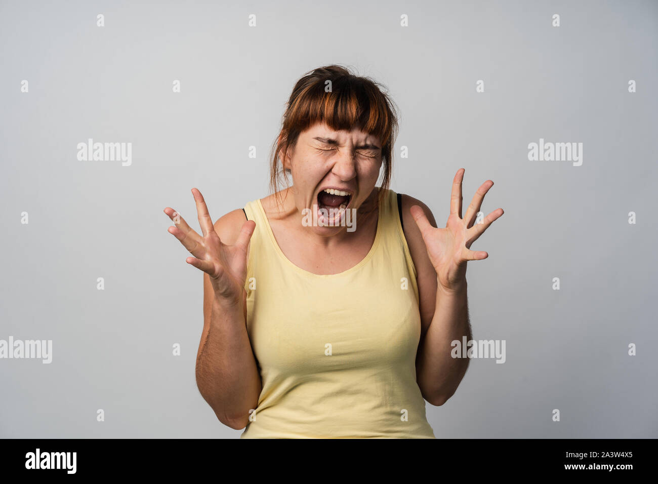 agressive wife look at camera. Studio with white background Stock Photo ...