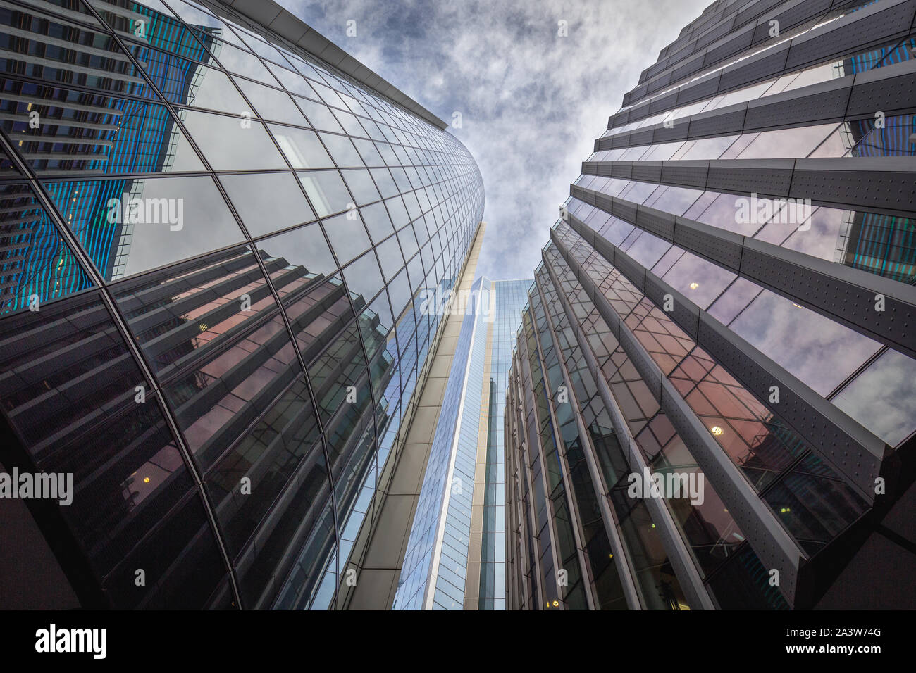 Skyscrapers from low angle. Hight glass walls reflecting other ...