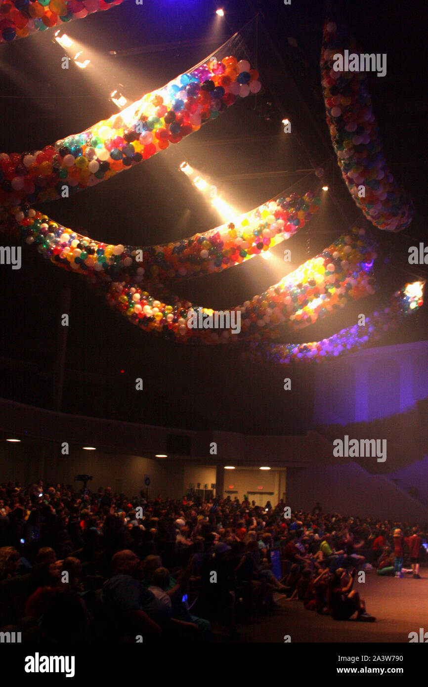 Hundreds of balloons hanging from the ceiling during Vacation Bible ...