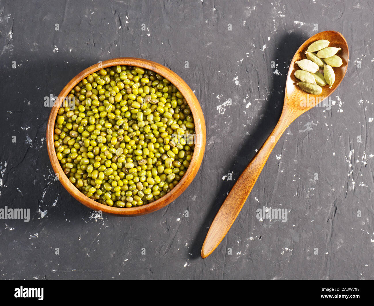 Green gram on a black concrete background. Indian cuisine ingredients ...