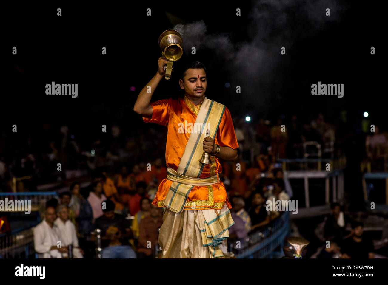 A hindu devotee performing a ritual in the holy city of Varanasi, India ...