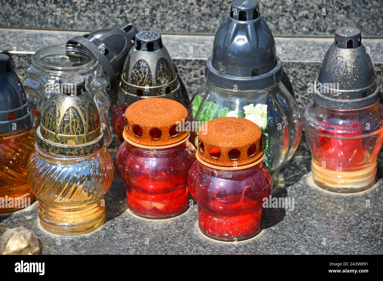 Lanterns on the tombstone in the public cemetery Stock Photo - Alamy