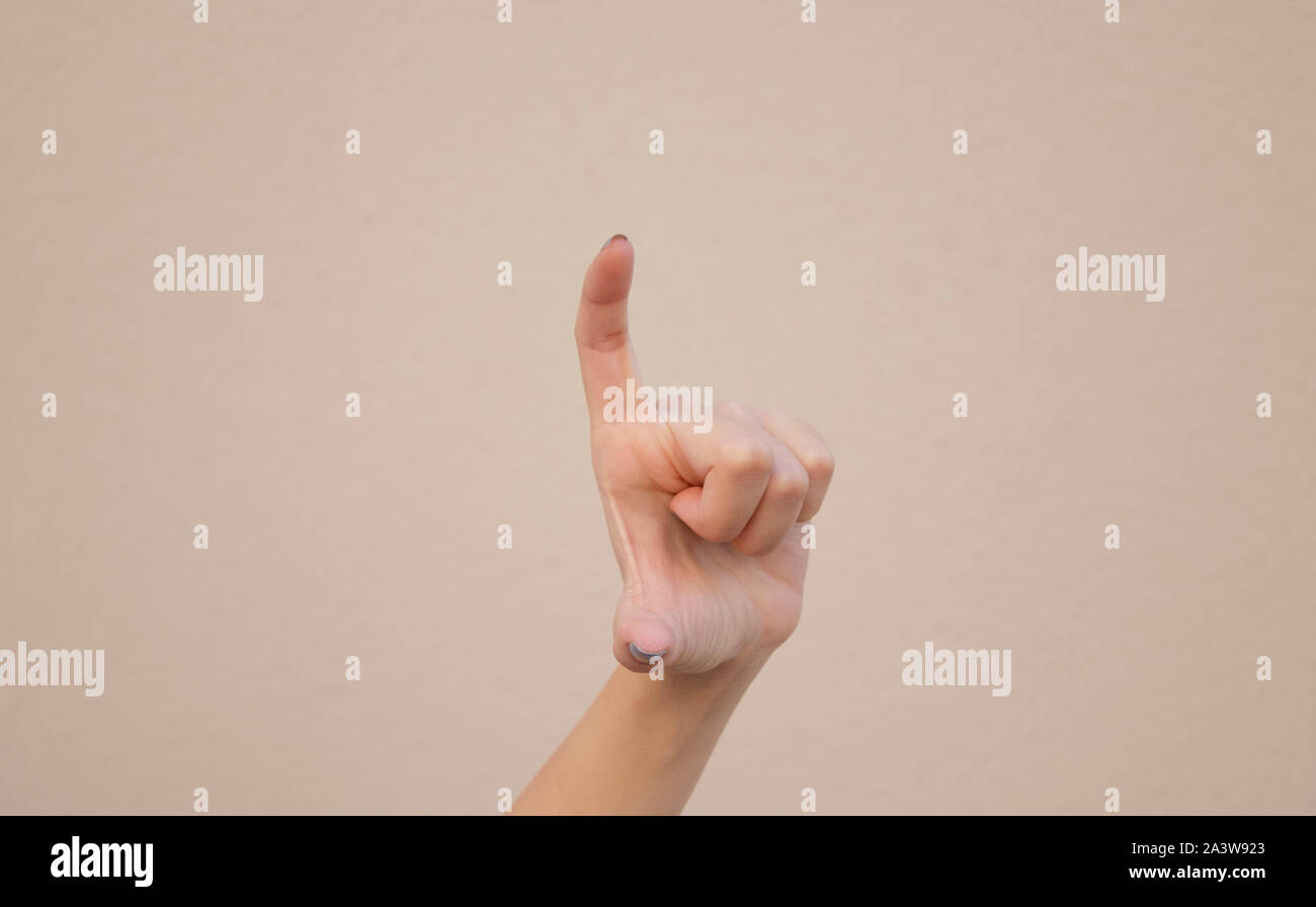 Female hand holding and showing product or object, isolated background ...