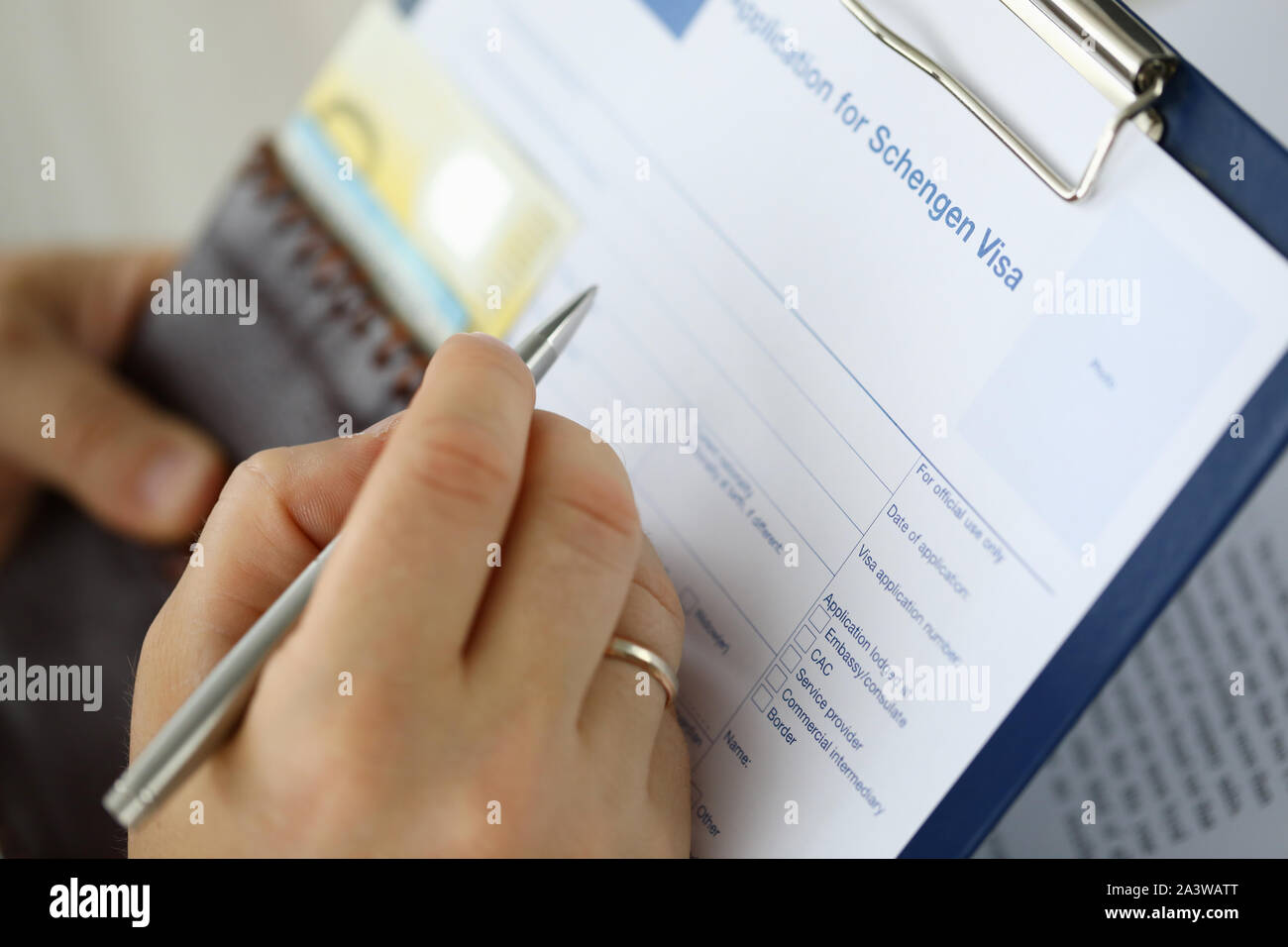 Man filling important documents Stock Photo - Alamy