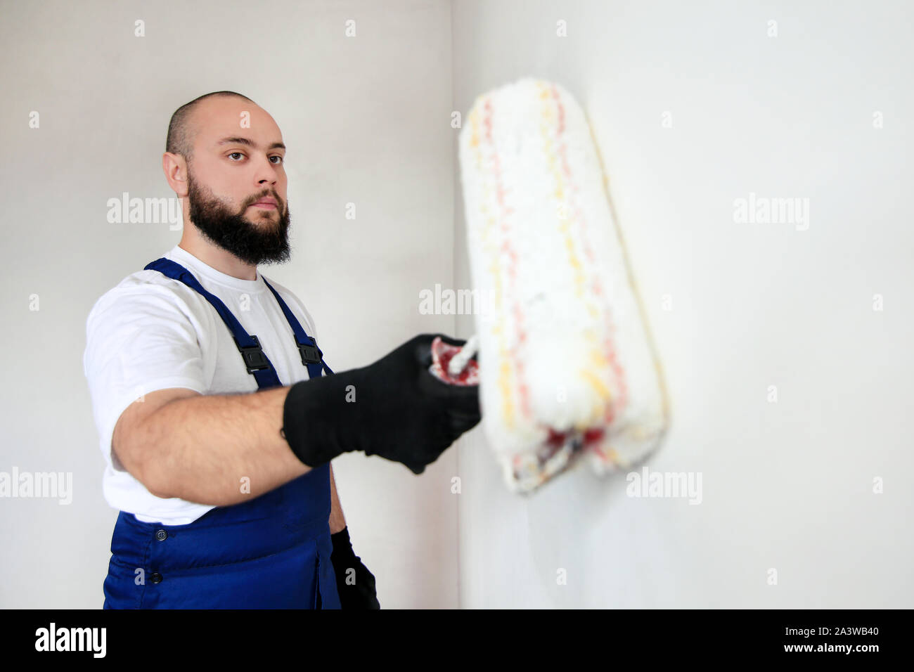 Construction worker doing finish renovation at apartment. Professional ...