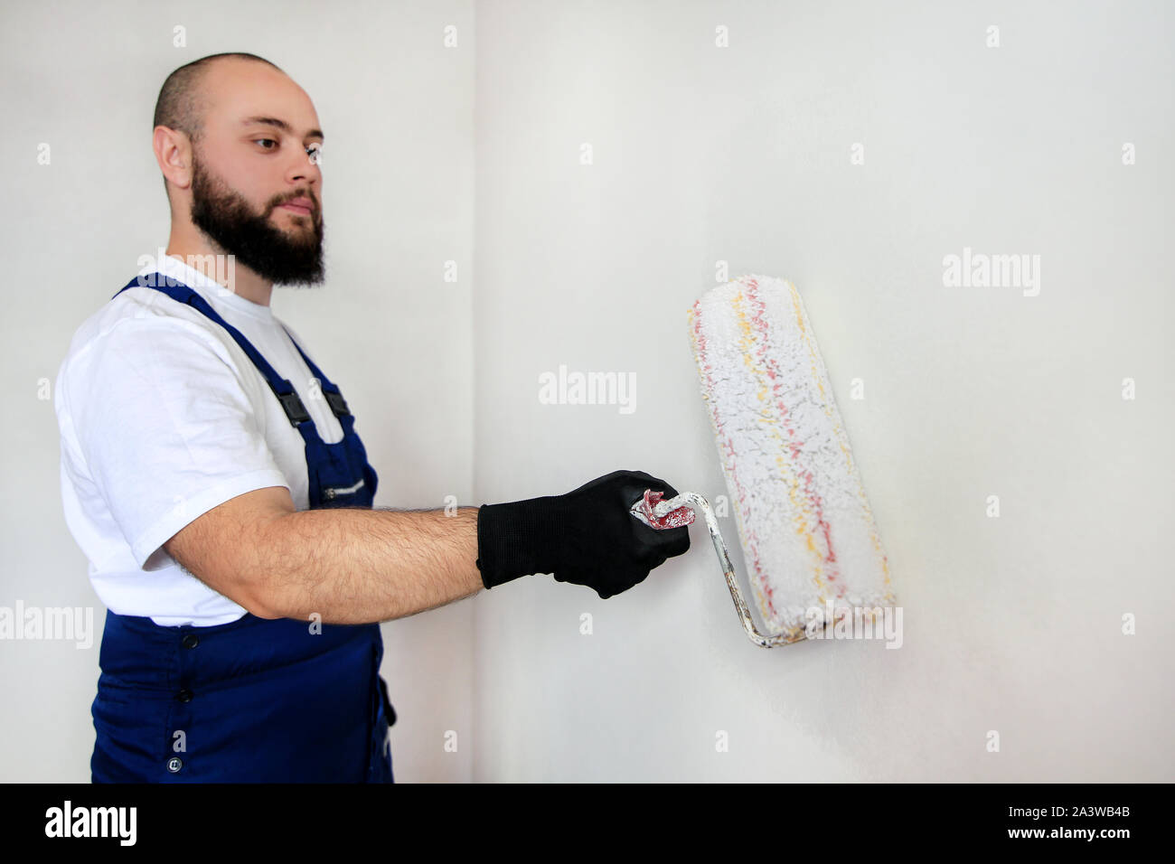 Construction worker doing finish renovation at apartment. Professional ...