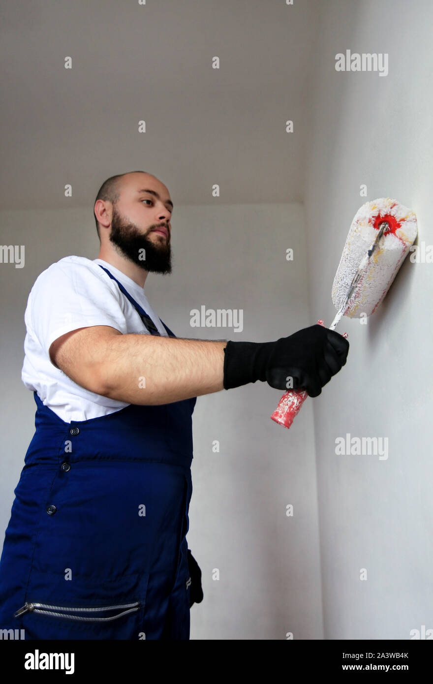 Construction worker doing finish renovation at apartment. Professional ...