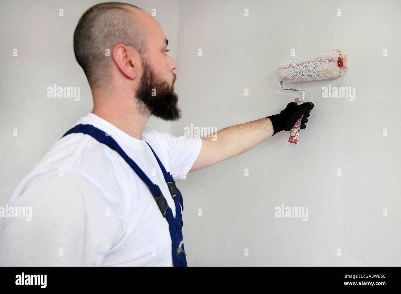Construction worker doing finish renovation at apartment. Professional ...