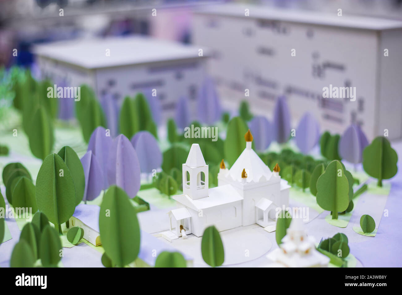 Handmade small white cardboard church and trees Stock Photo - Alamy