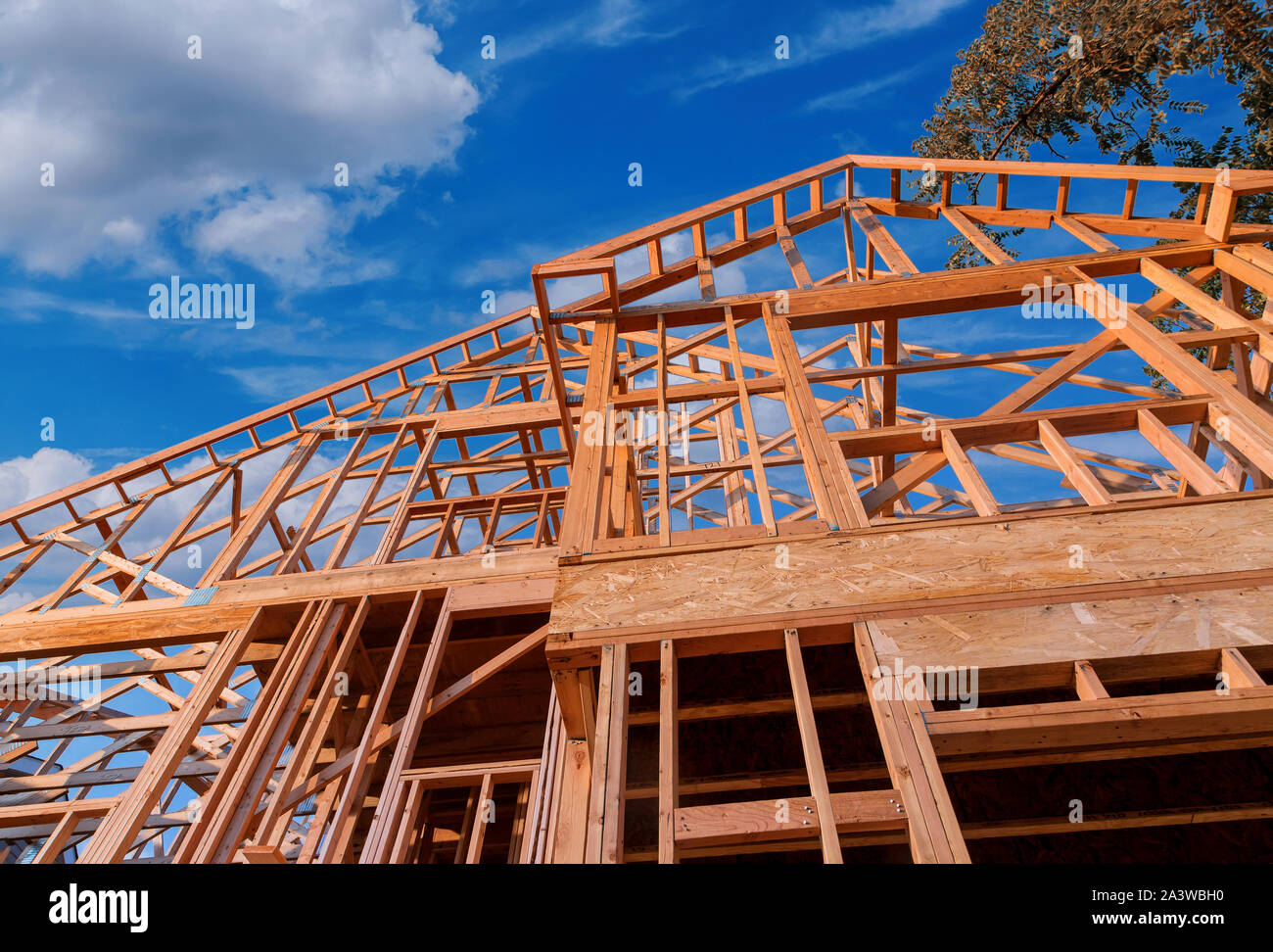 Home new wood frame stick built home under construction a blue sky ...