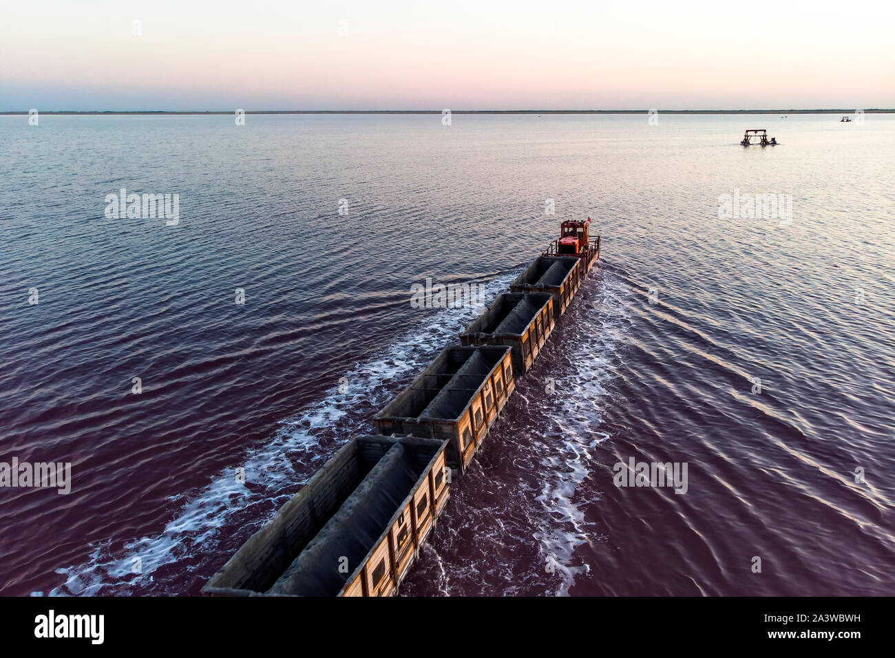 Awesome train rides on the rail in the water with white salt on the ...