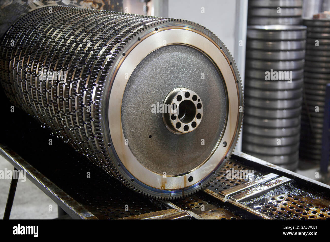 stacked steel pulleys inside factory Stock Photo - Alamy