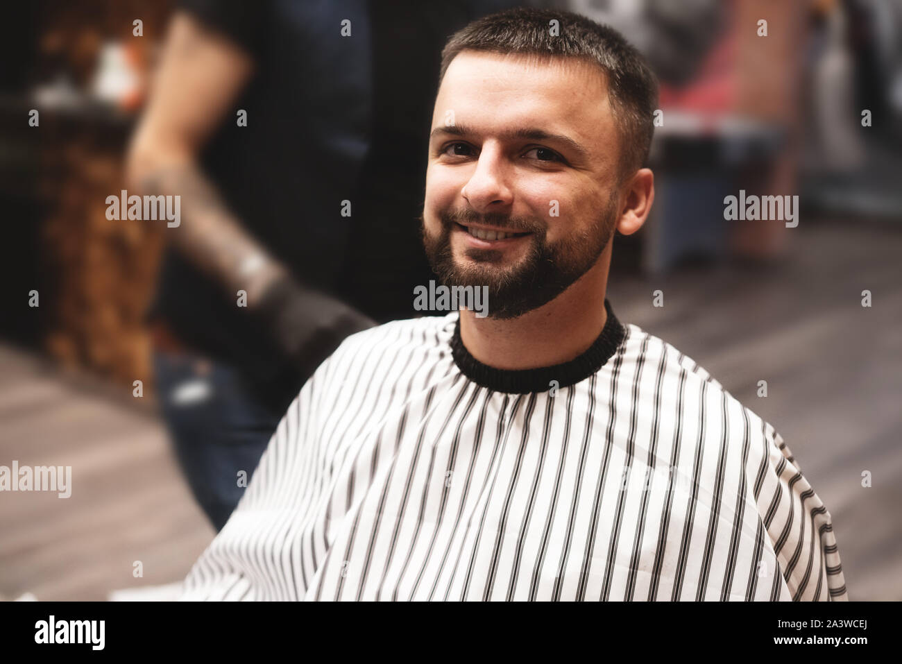 Haircut head in barbershop. Barber cuts the hair on the head of the ...