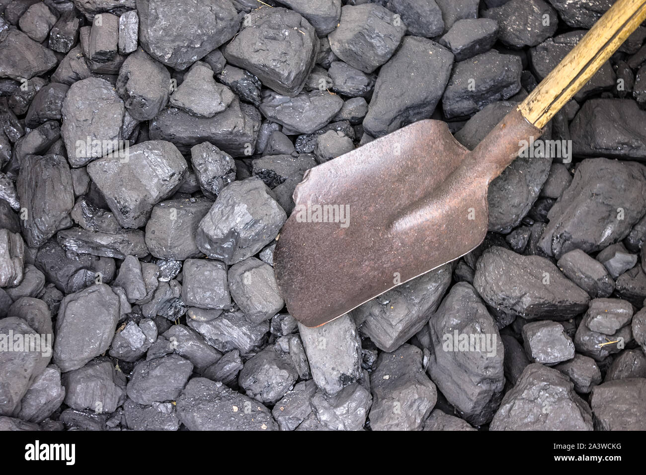 Coal industry, coal in a warehouse with a shovel Stock Photo - Alamy