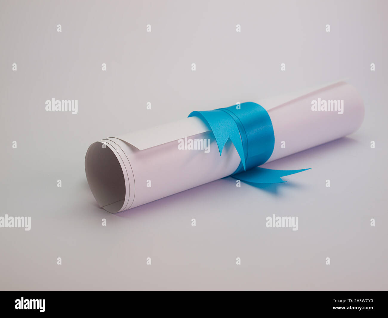 Rolled up graduation diploma scroll hi-res stock photography and images ...