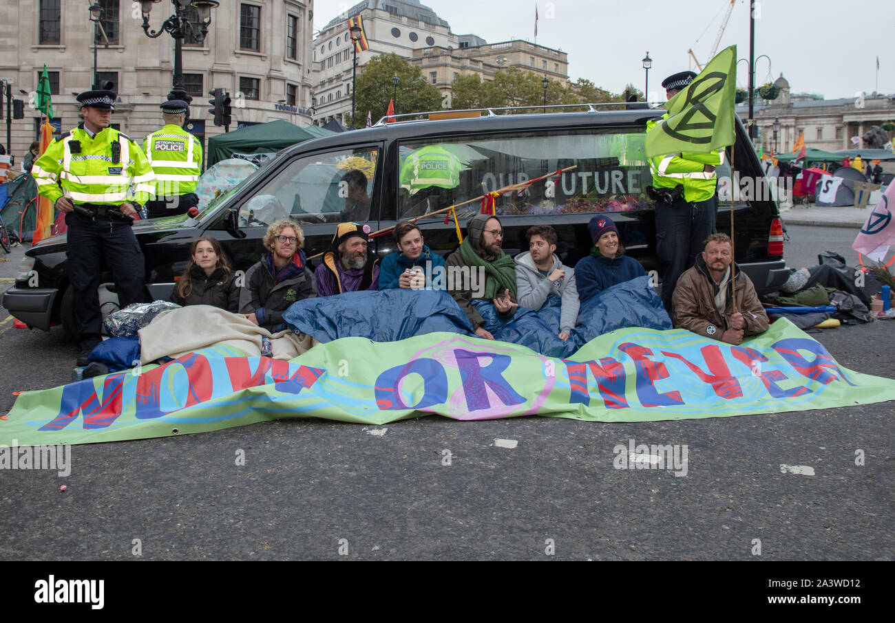 London, UK. 9th October 2019. Demonstrators seen in front of a hearse ...