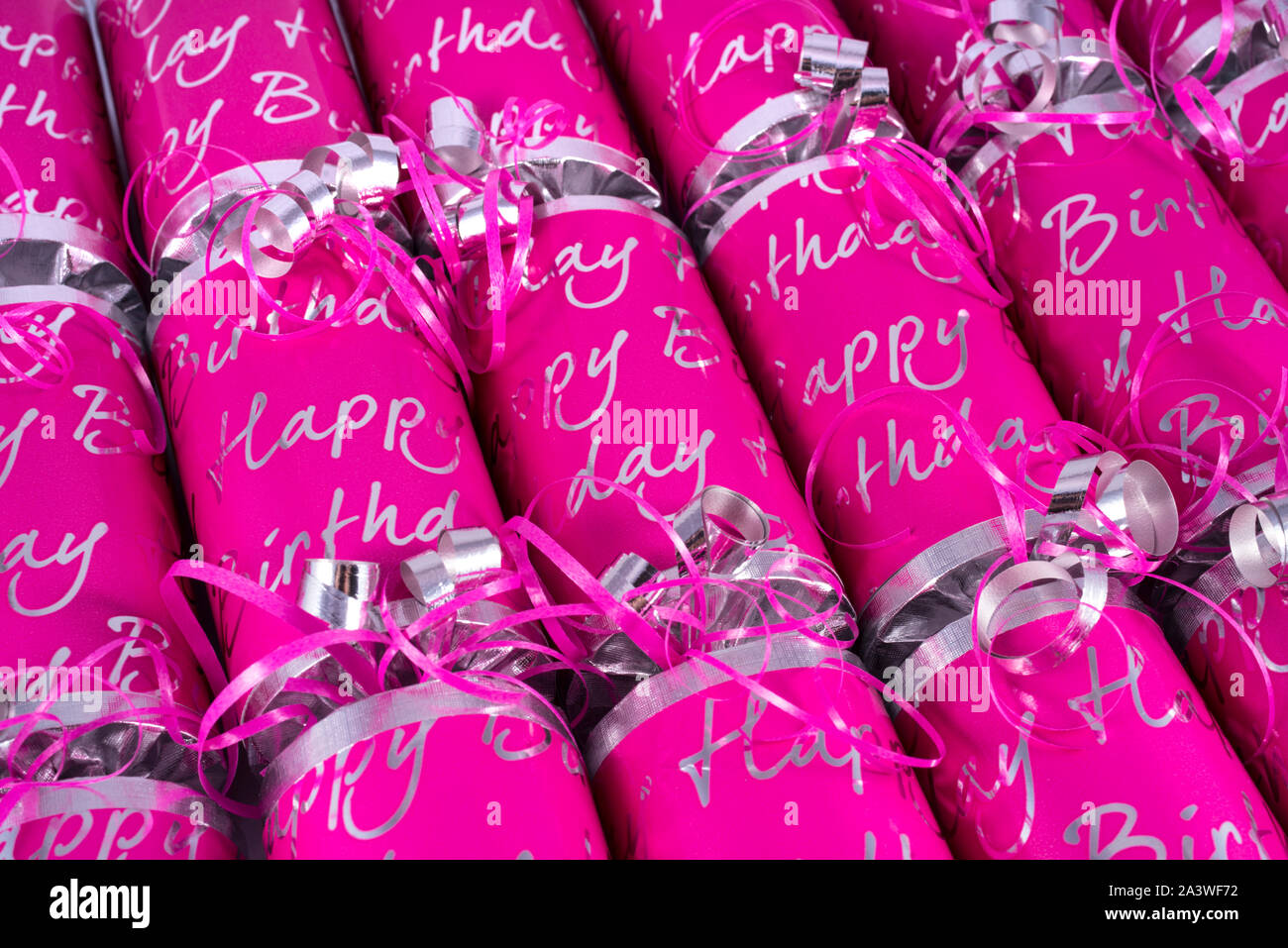 A studio shot of Happy Birthday Crackers Stock Photo - Alamy
