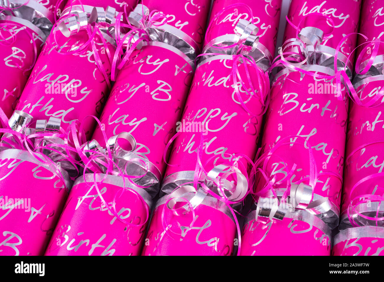 A studio shot of Happy Birthday Crackers Stock Photo - Alamy