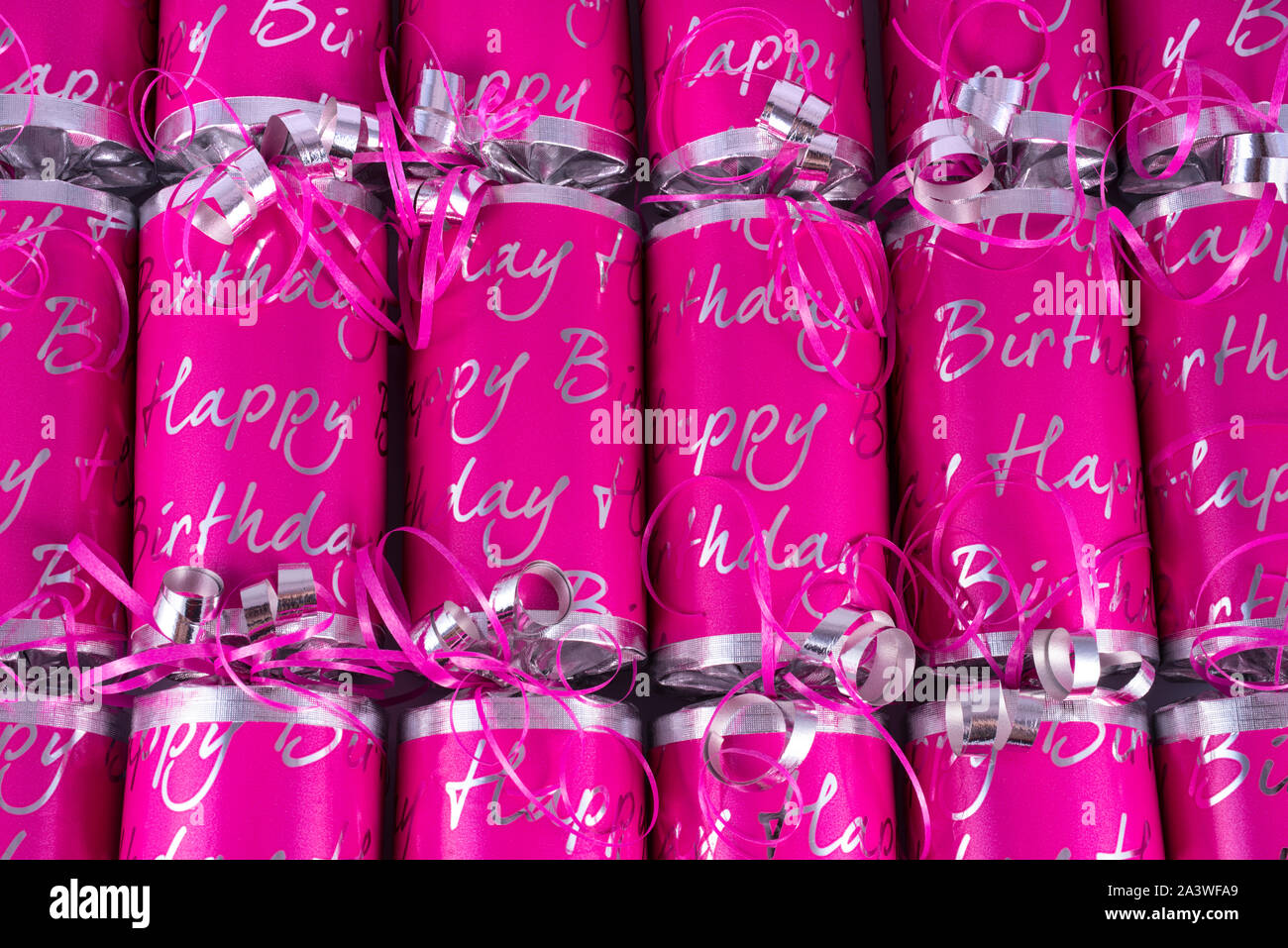 A studio shot of Happy Birthday Crackers Stock Photo - Alamy