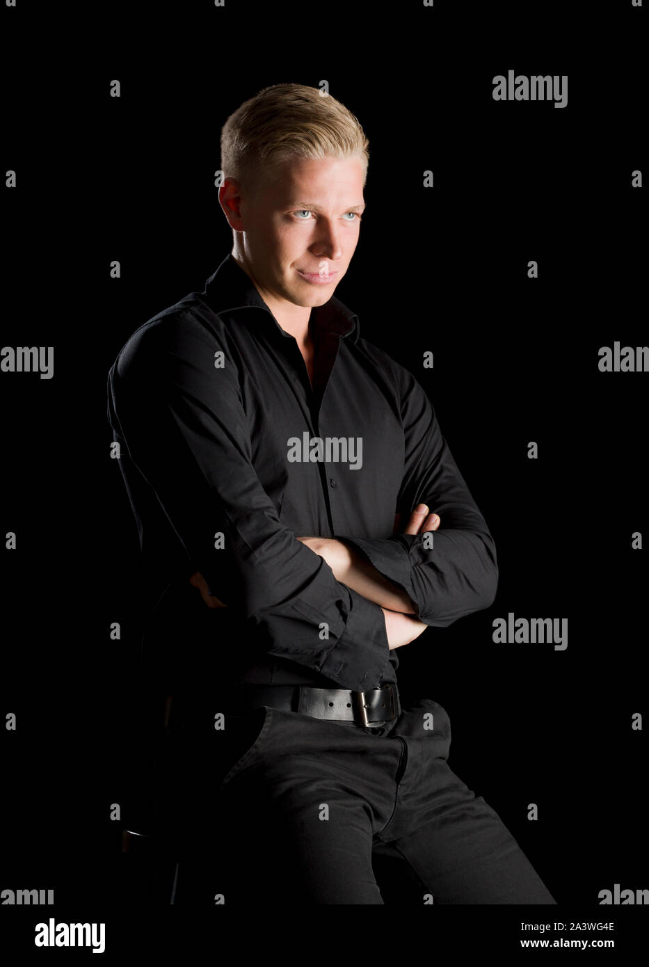 Low key portrait of young attractive man looking aside Stock Photo - Alamy