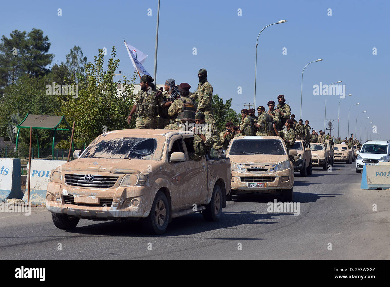 Ankara. 10th Oct, 2019. Members of the Syrian National Army head for ...