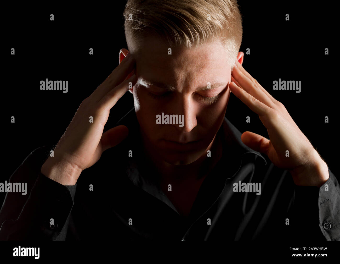 Low key portrait of serious man with eyes closed Stock Photo - Alamy