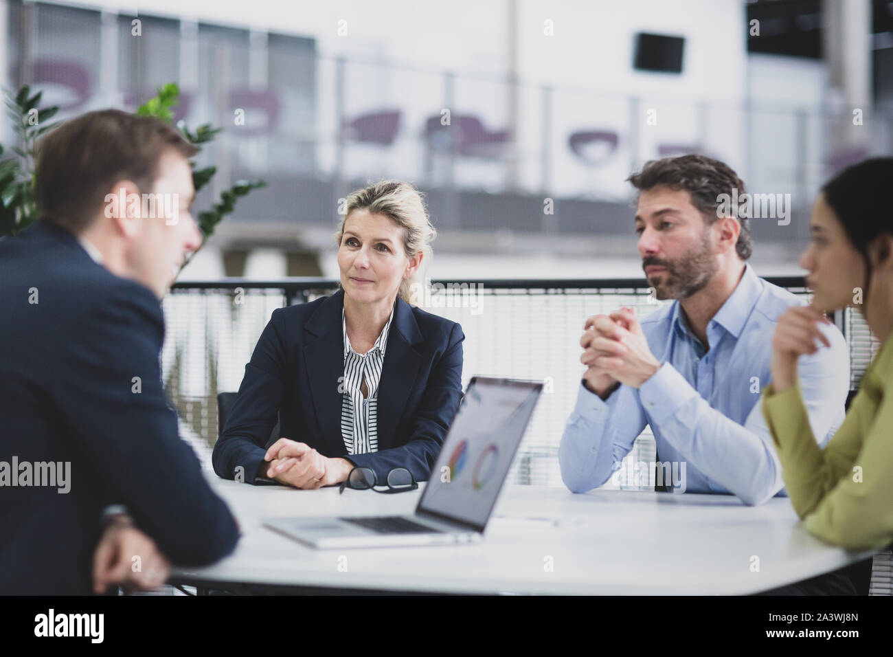 Corporate business executives listening in a meeting Stock Photo - Alamy