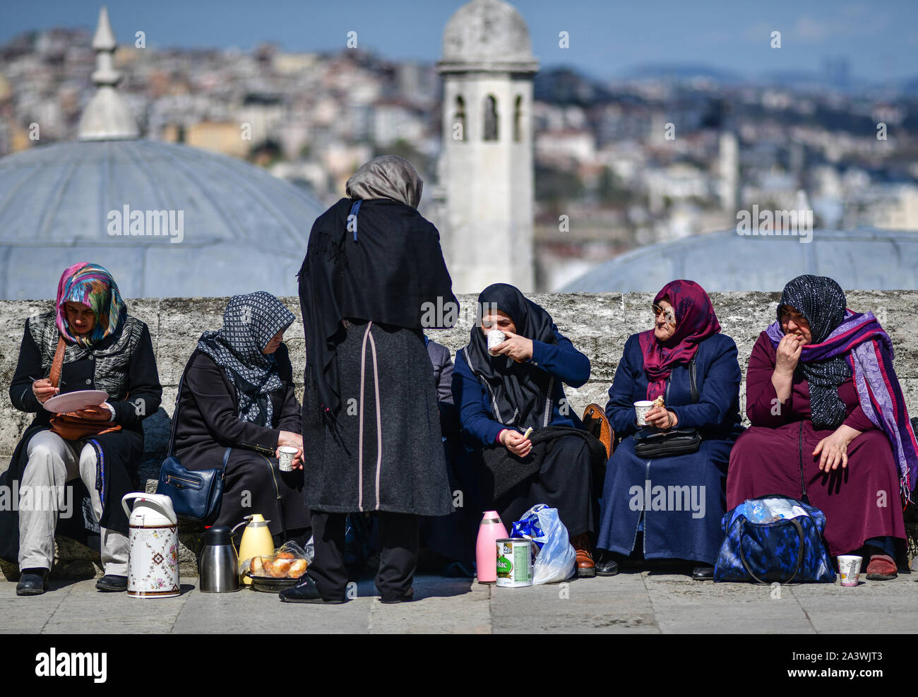 Turkey: Istanbul. Veiled Muslim women of different ages, seated, dining ...