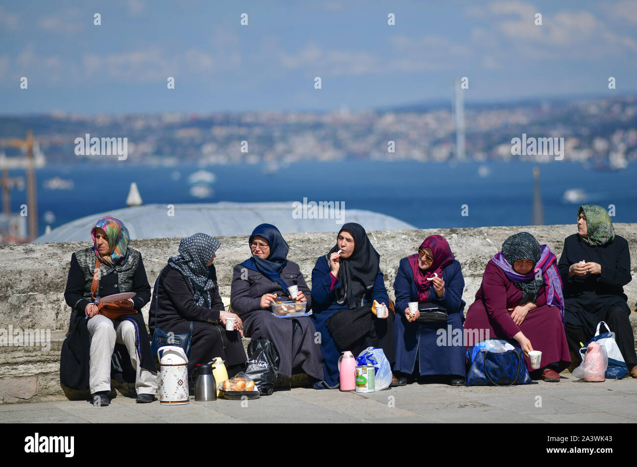 Turkey: Istanbul. Veiled Muslim women of different ages, seated, dining ...