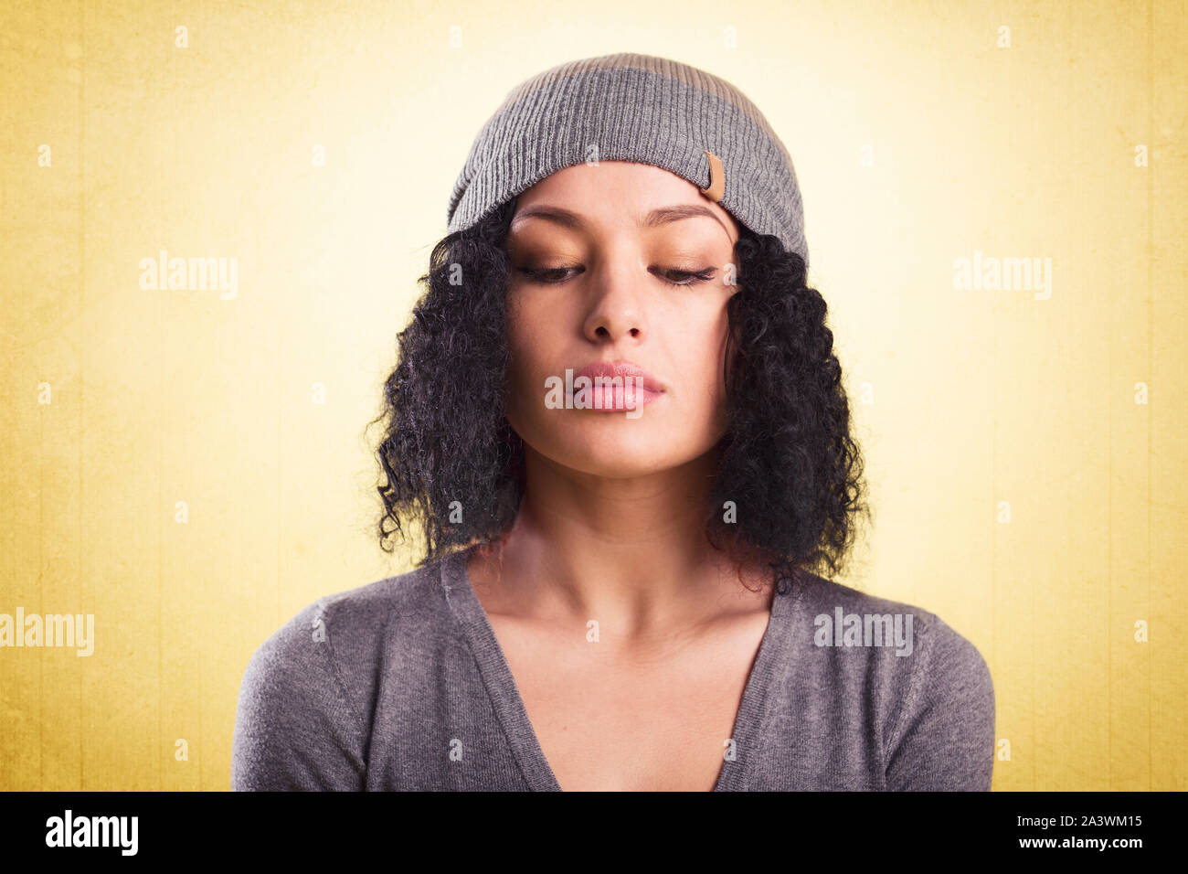 Hip girl with half closed eyes isolated on yellow background Stock ...