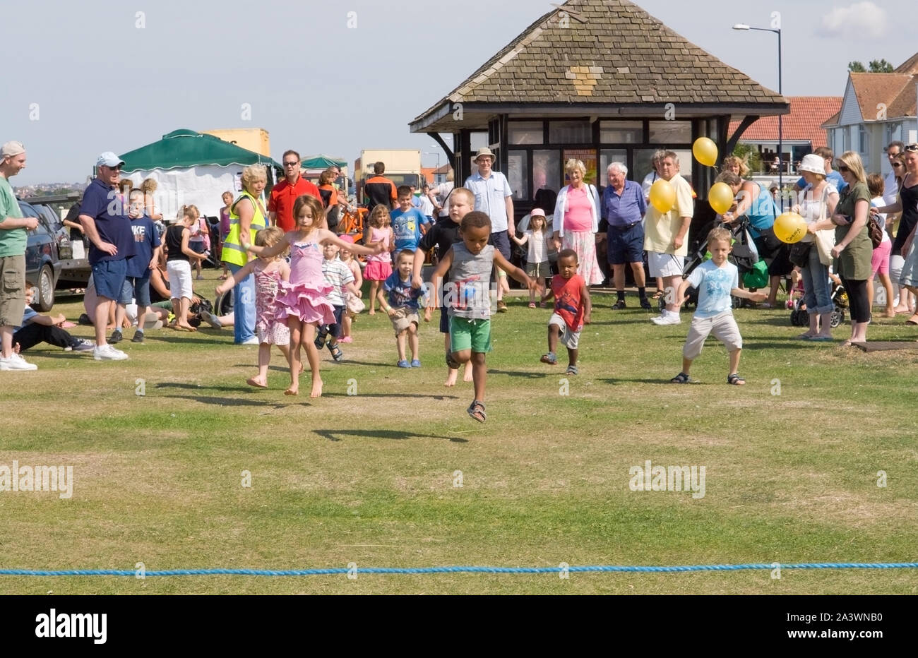 Children in a jumping race at a local fair Stock Photo - Alamy